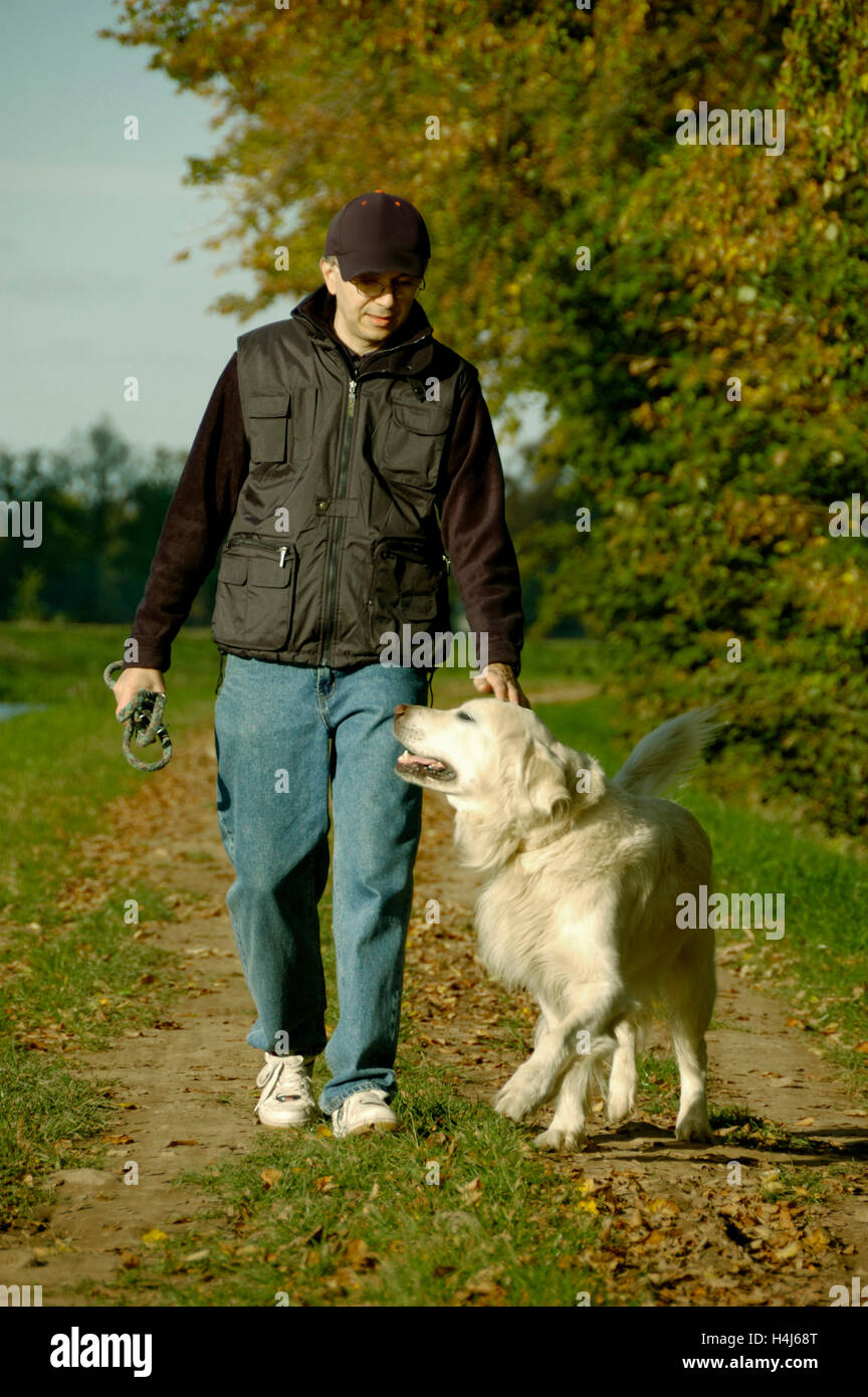 man and dog walking together Stock Photo - Alamy