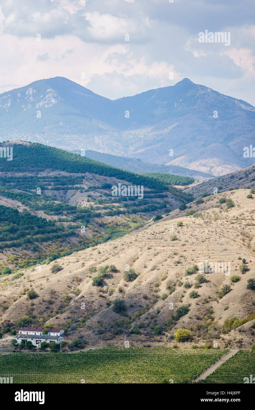 Silent scenic terrain, hills, mountains and lonely house Stock Photo ...