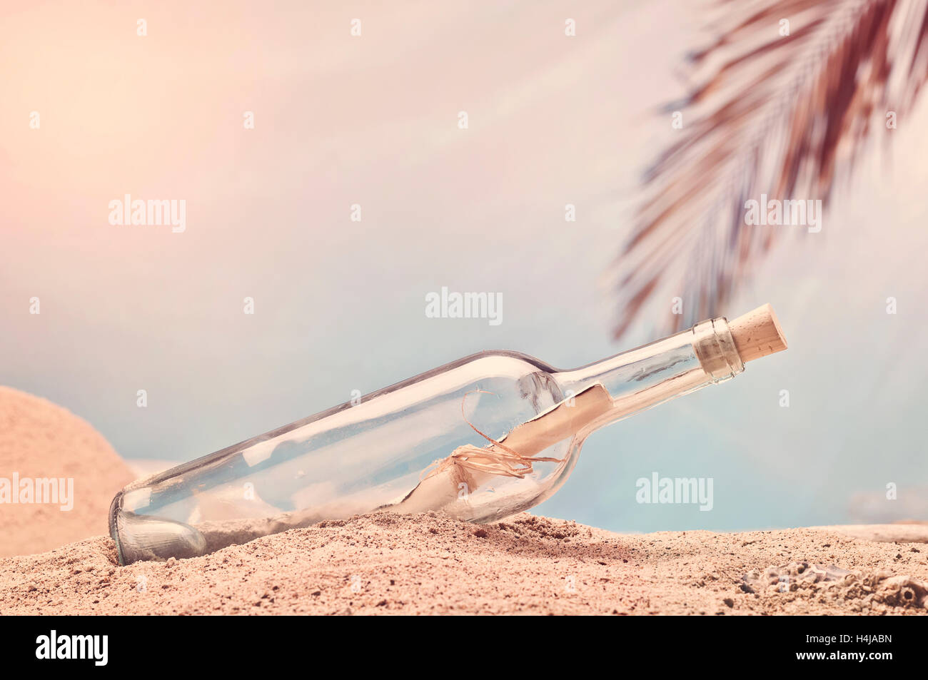 Help message in a bottle on beach Stock Photo - Alamy
