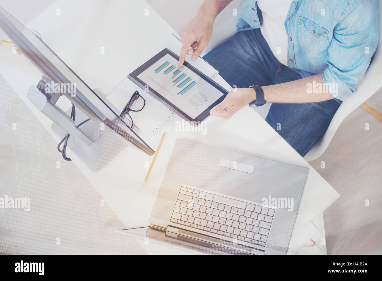 Concentrated man working as a programmer Stock Photo - Alamy