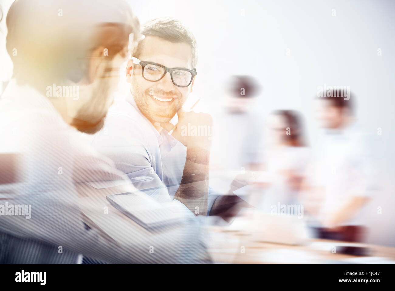 Smiling man during business meeting with his partner Stock Photo - Alamy