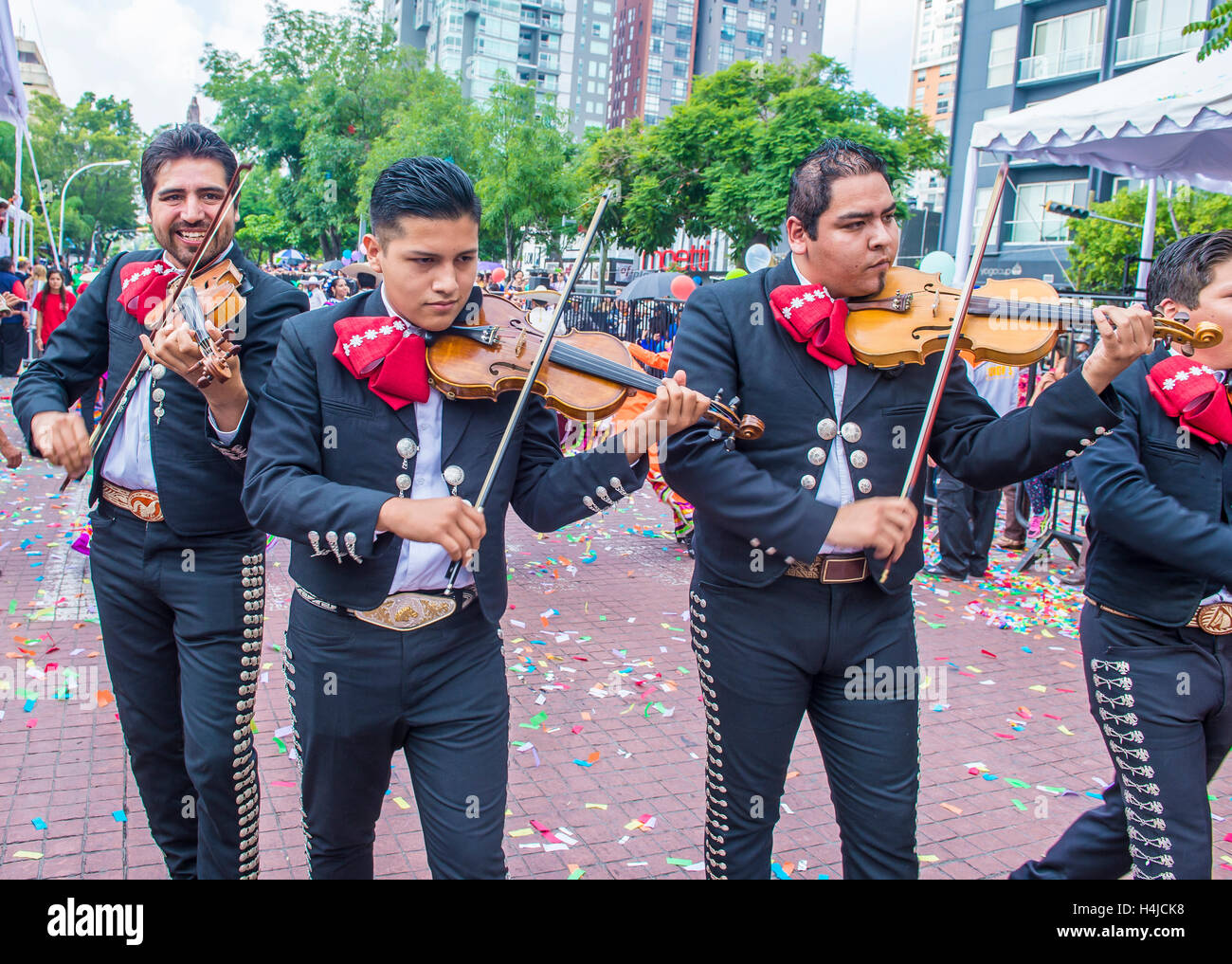 Participants in a parade during the 23rd International Mariachi ...