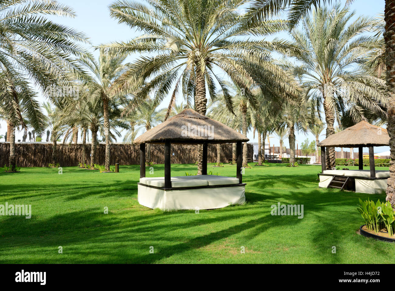 The bali relaxation hut on a green lawn dubai hi-res stock photography ...