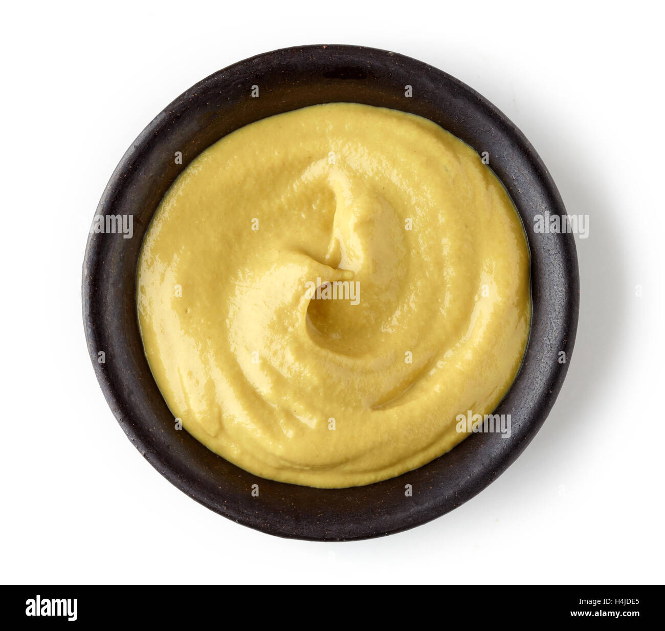Mustard in round dish isolated on white background, top view Stock ...
