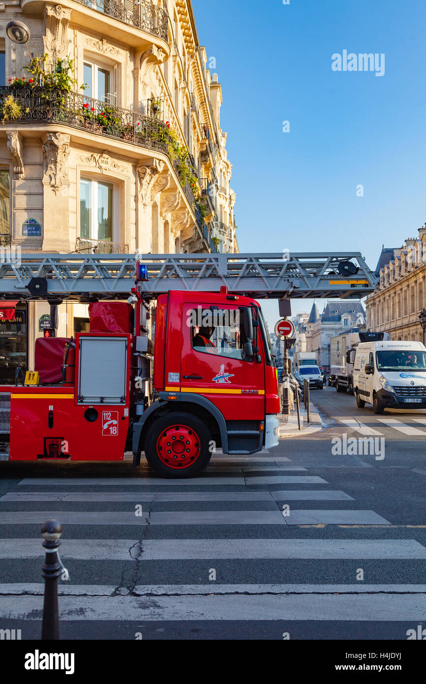 Paris, France - October 12, 2016: Fireman in his red fire truck in the ...