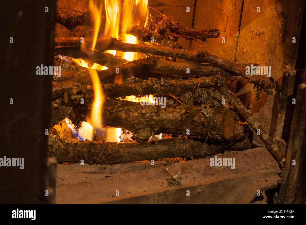 Lighting a wood burner Stock Photo - Alamy