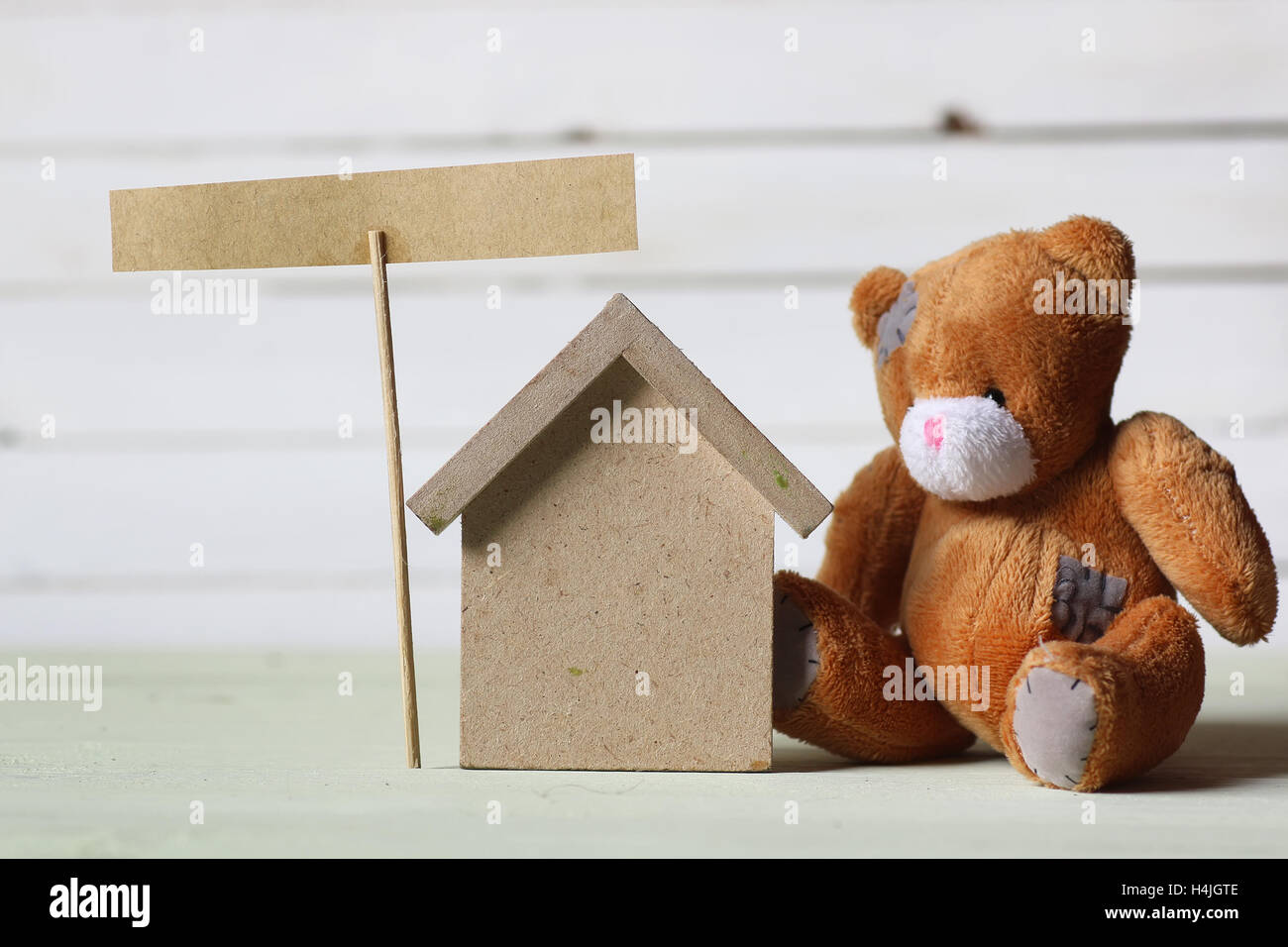 a toy house and sign board Stock Photo - Alamy