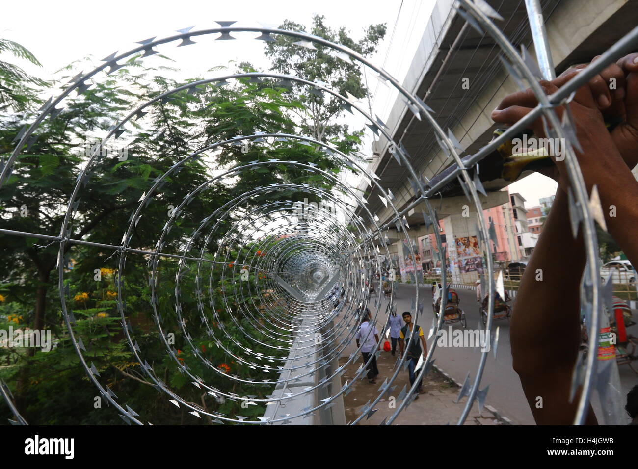 Secured with razor wire on top of the iron fence Stock Photo - Alamy