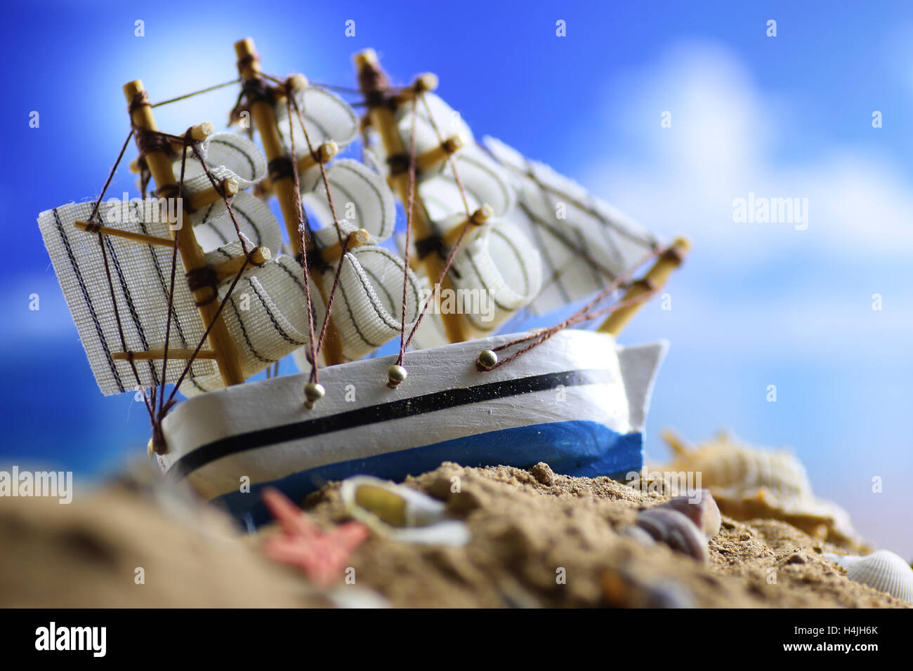 sand shell and sail in sea Stock Photo - Alamy