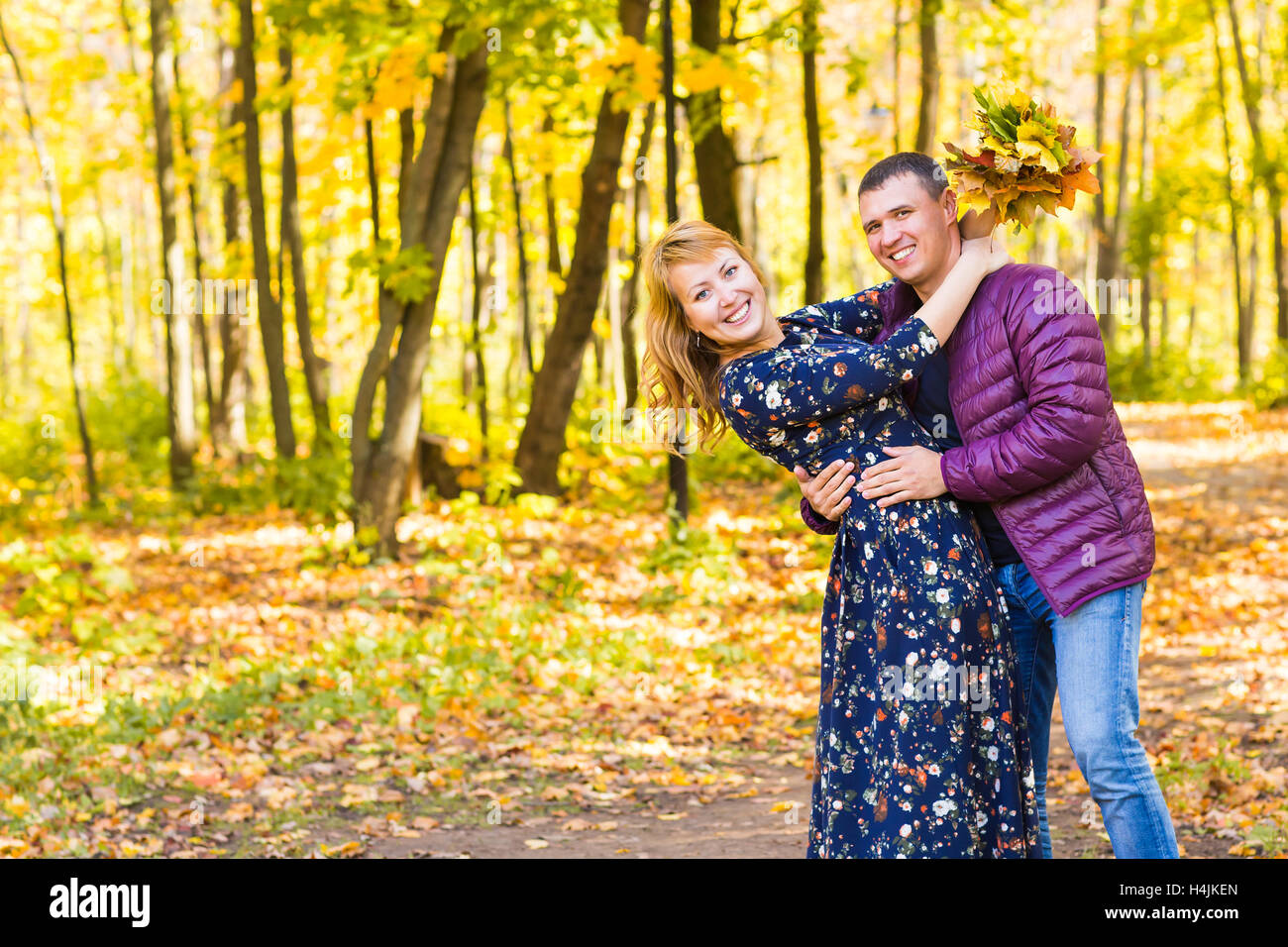 love, relationship, family and people concept - couple in autumn park ...