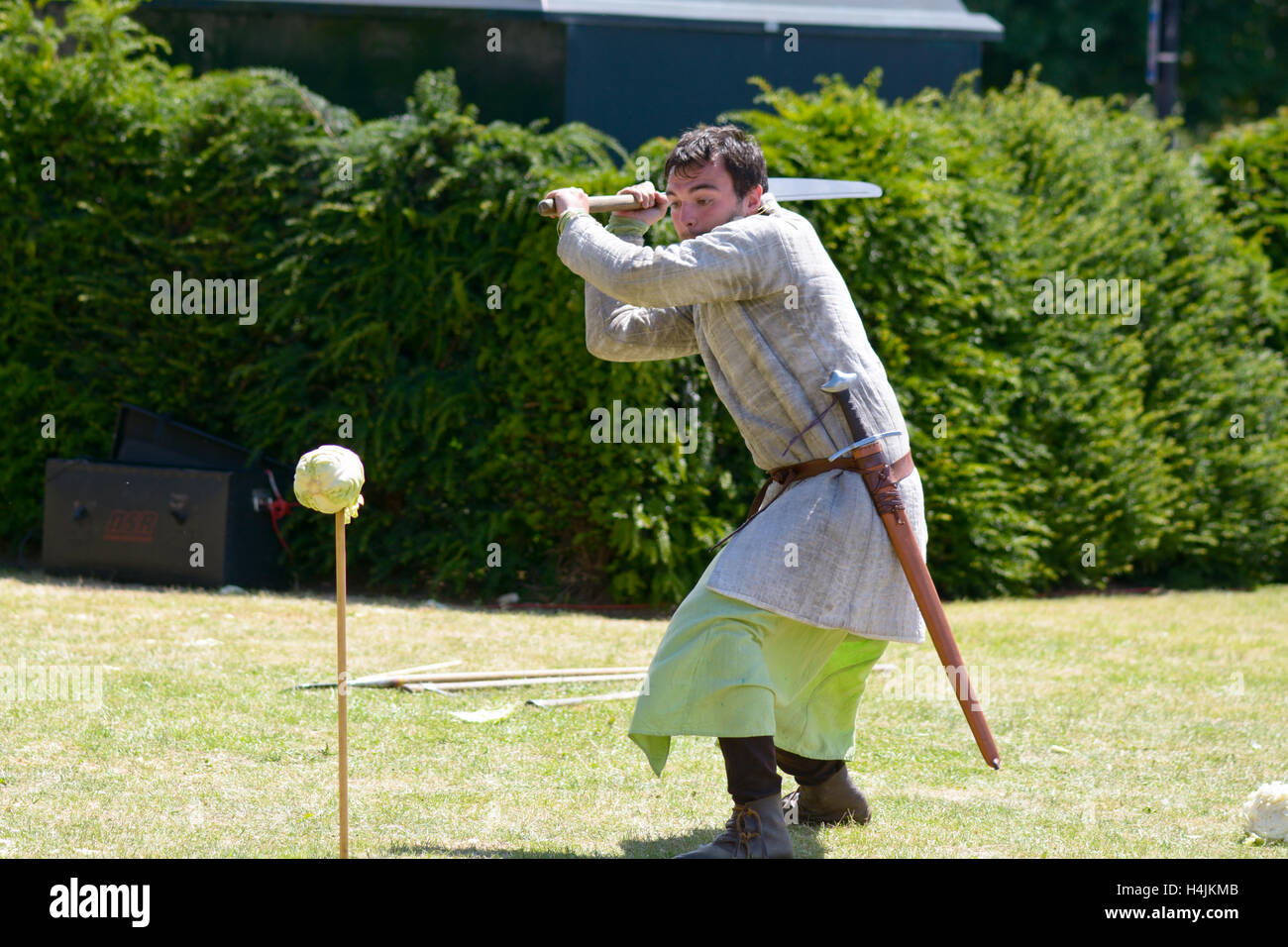 12th Century knight reenactment group displaying use of weapons to the ...