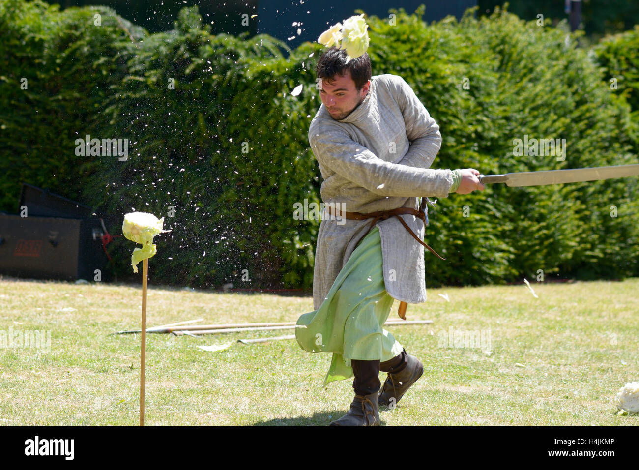 12th Century knight reenactment group displaying use of weapons to the ...