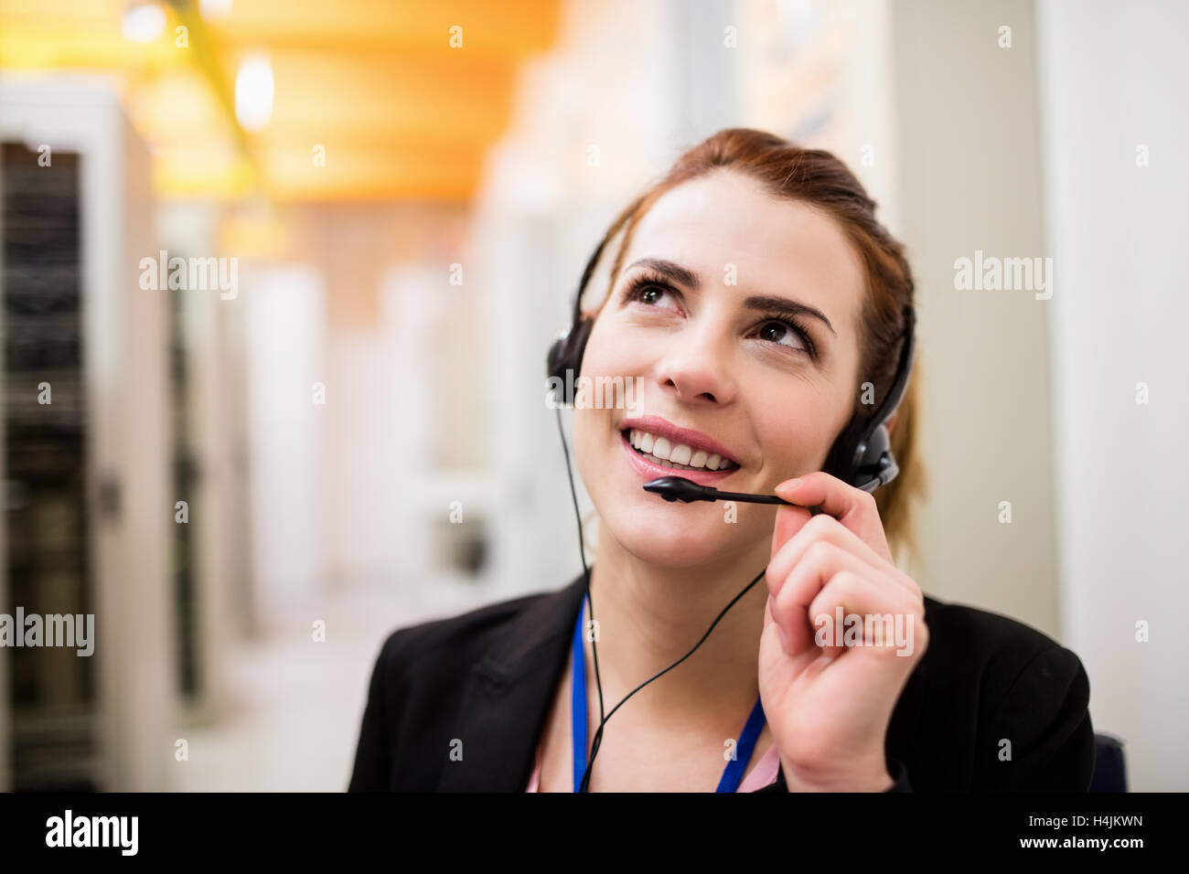 Technician talking on headset Stock Photo - Alamy
