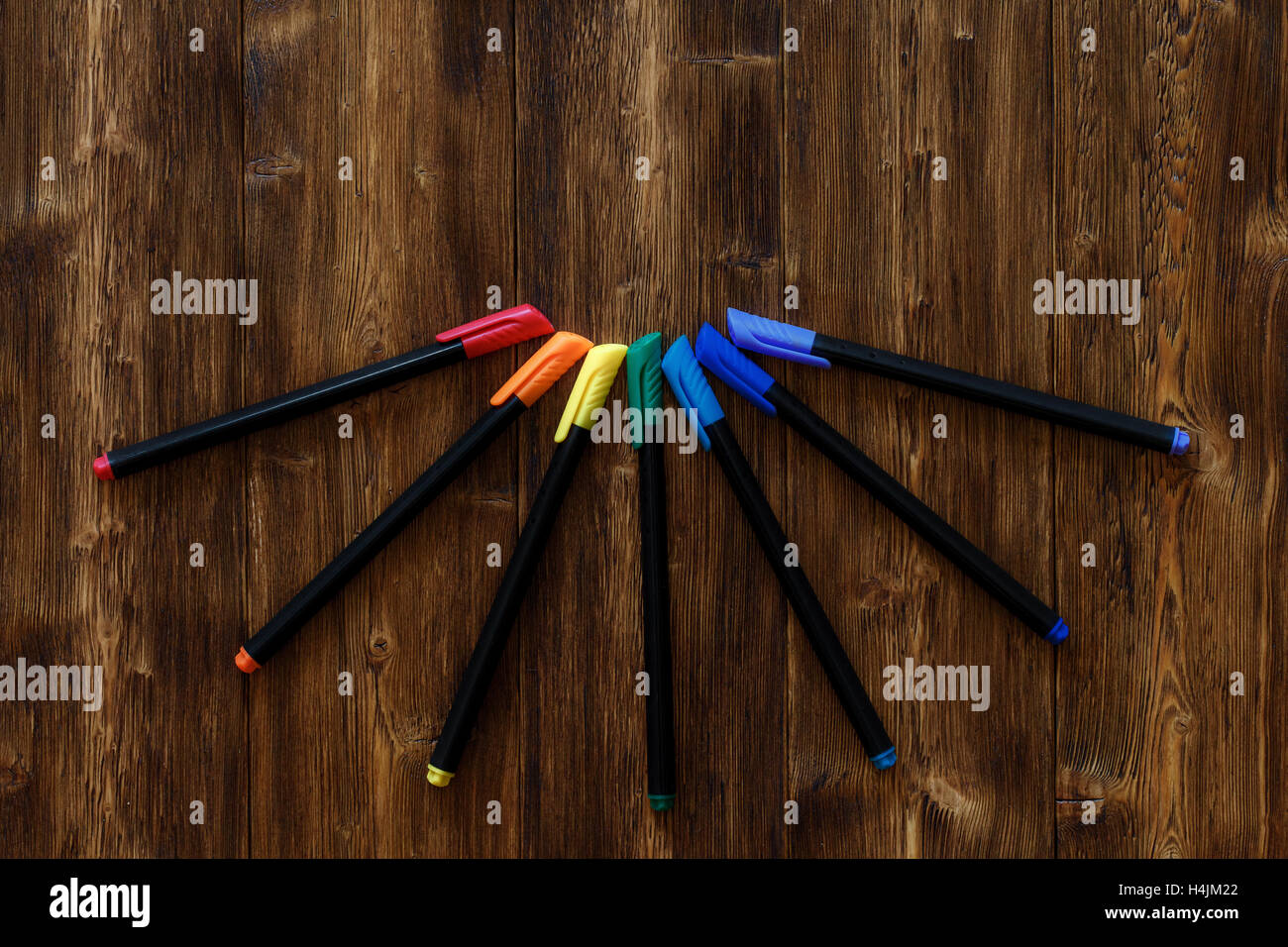 Lots of assorted rainbow colors marker pens, copyspace wooden ...