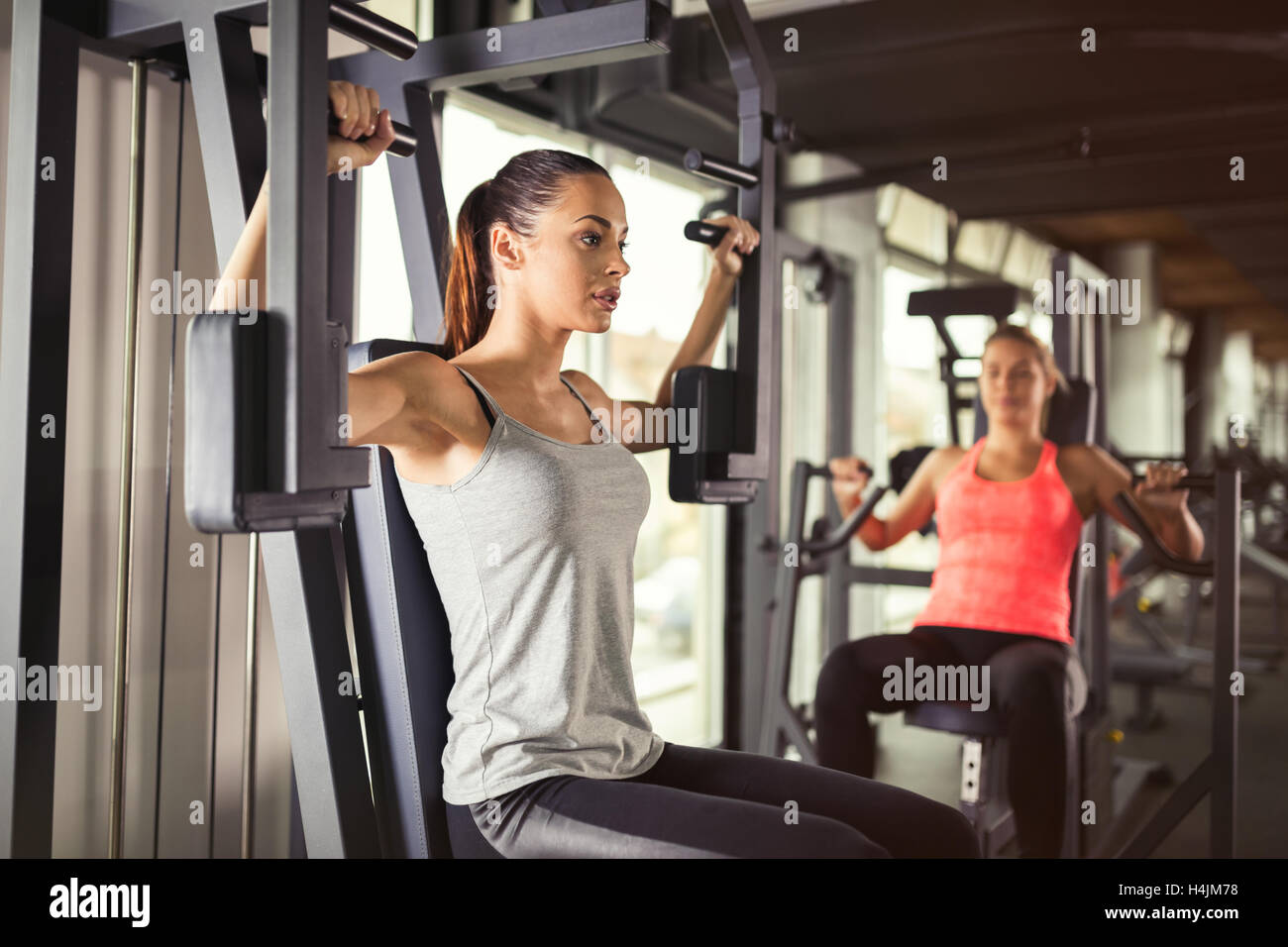 Women working out in gym strengthening their physique Stock Photo - Alamy