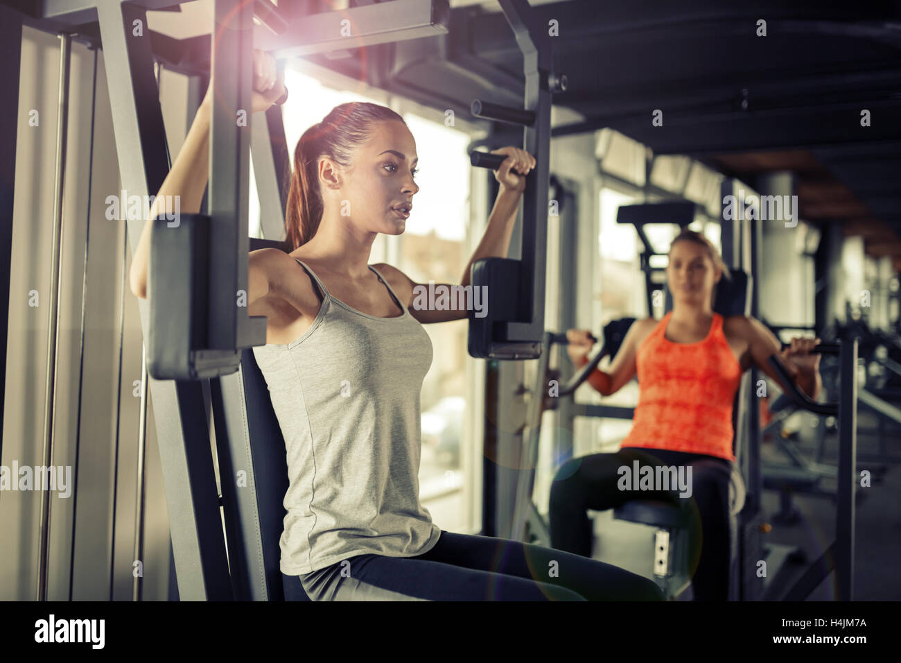 Women working out in gym strengthening their physique Stock Photo - Alamy
