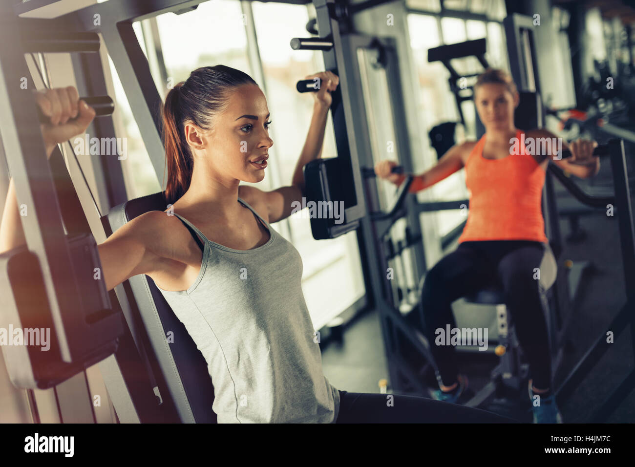 Women working out in gym strengthening their physique Stock Photo - Alamy