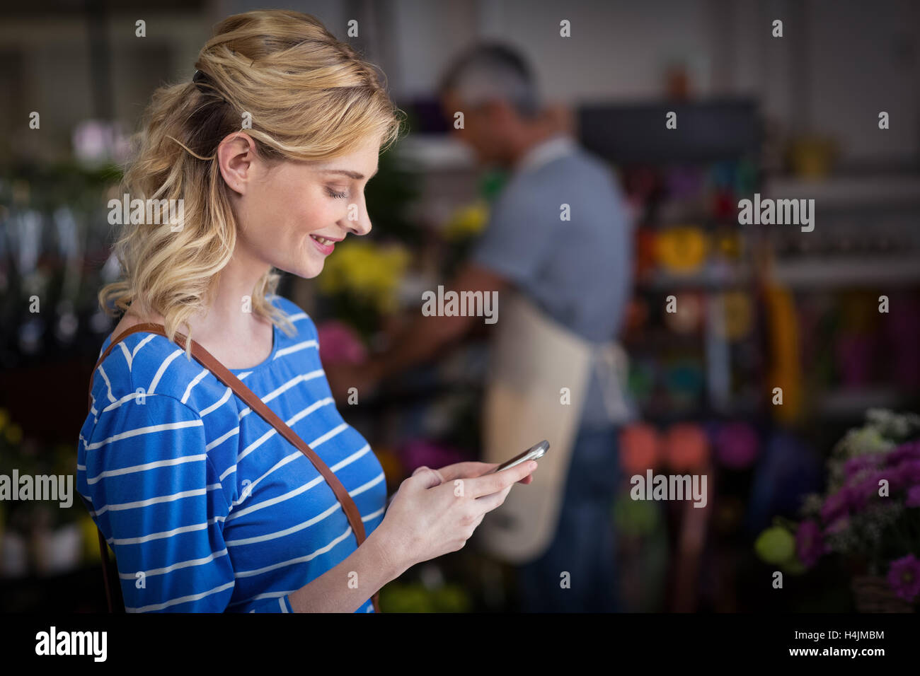 Woman using electronic device hi-res stock photography and images - Alamy