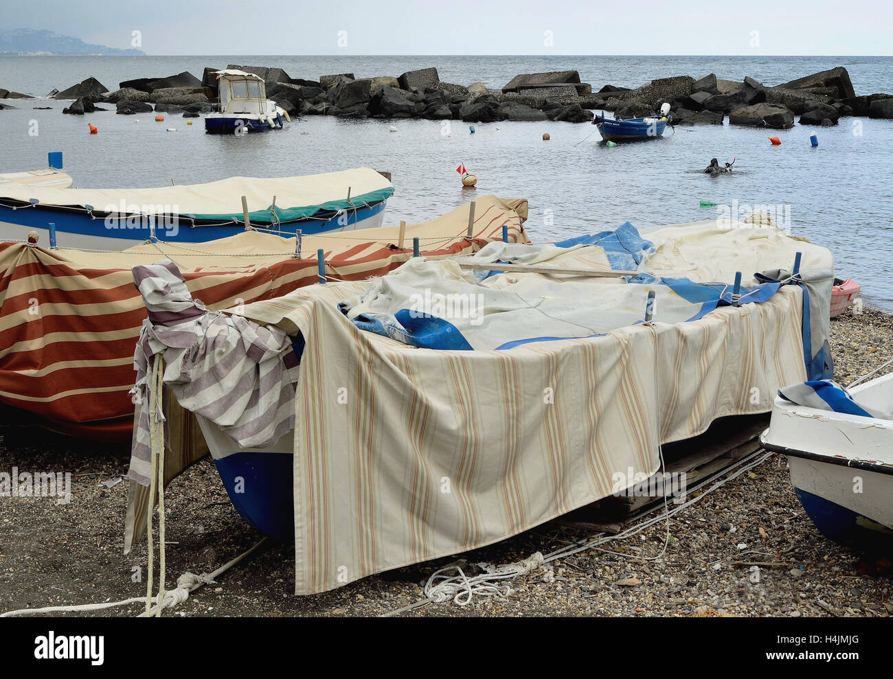 Covered boats moored sea sky boat hi-res stock photography and images ...