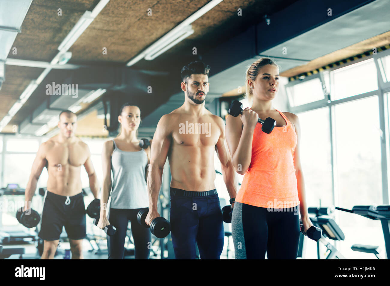 Group of athletic people working out in gym Stock Photo - Alamy