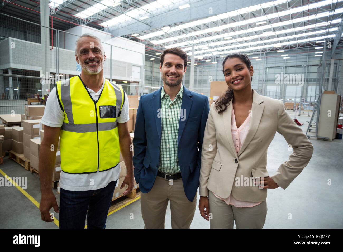 Portrait of warehouse team standing together Stock Photo - Alamy