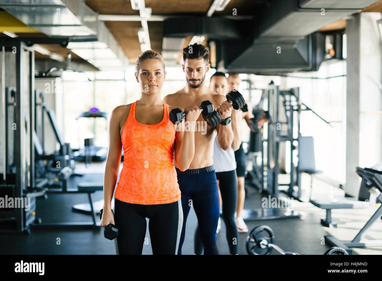 Group of athletic people working out in gym Stock Photo - Alamy