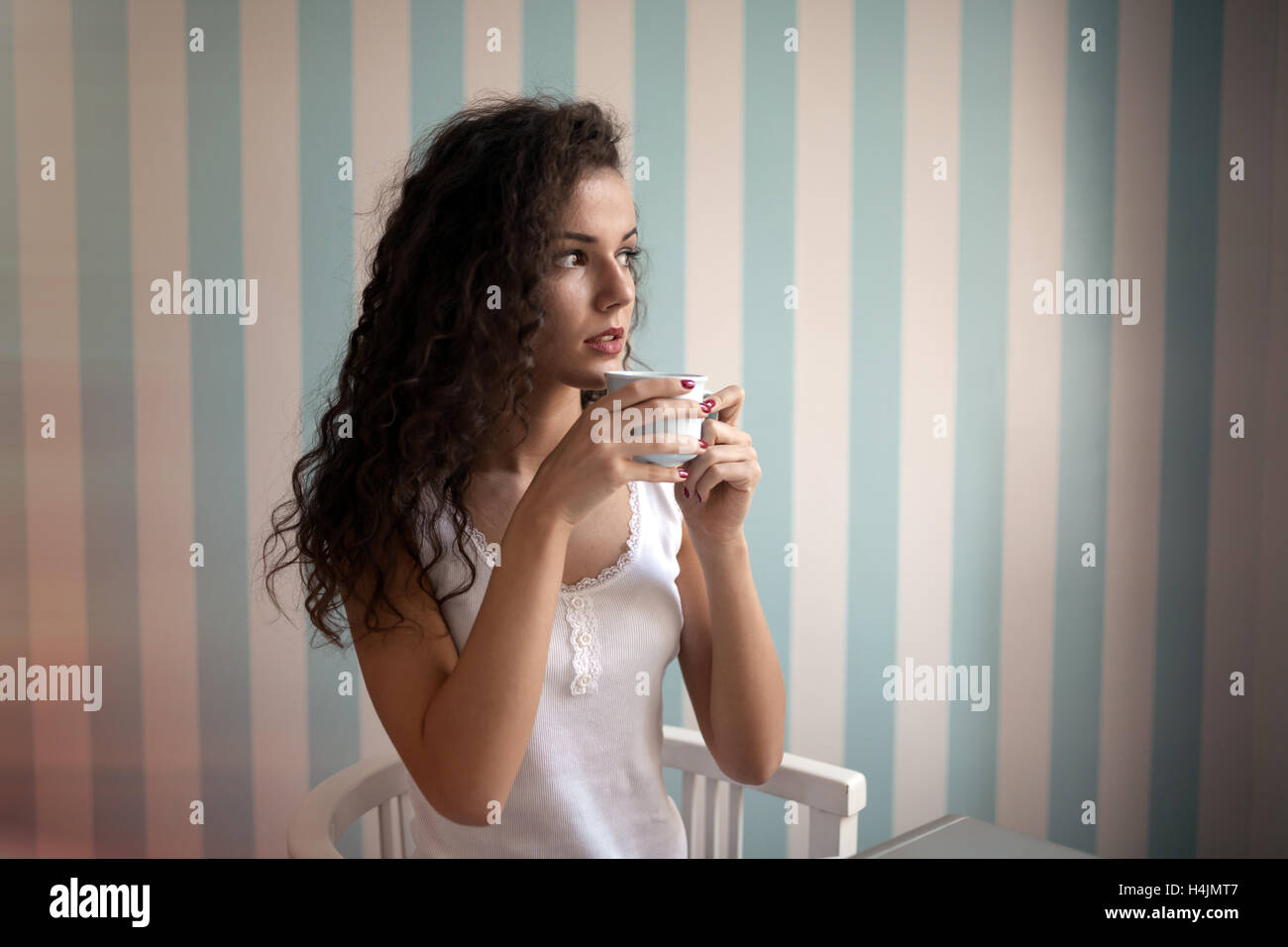 Beautiful woman having morning coffee Stock Photo - Alamy