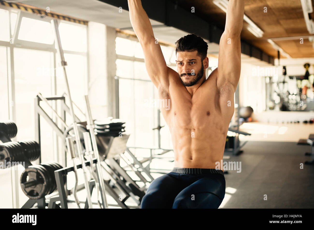 Abs workout by handsome man in gym Stock Photo: 123342782 - Alamy