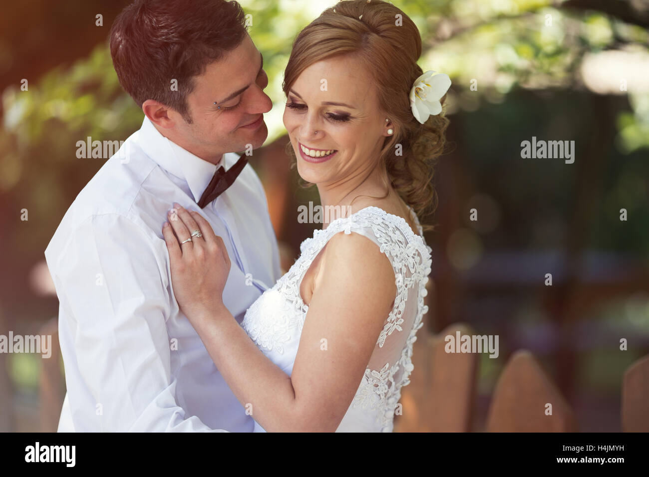 Beautiful bride and groom kissing outdoors after ceremony Stock Photo ...