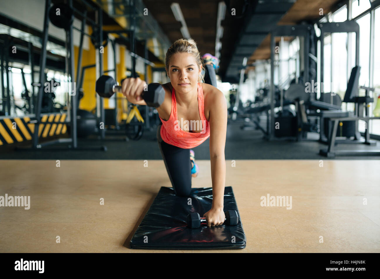 Beautiful woman working out in gym Stock Photo - Alamy
