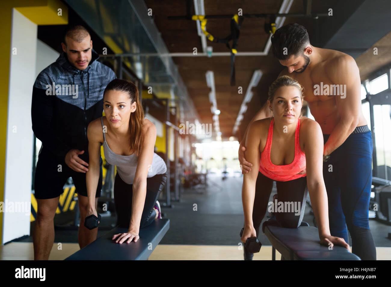 Group of athletic people working out in gym Stock Photo - Alamy