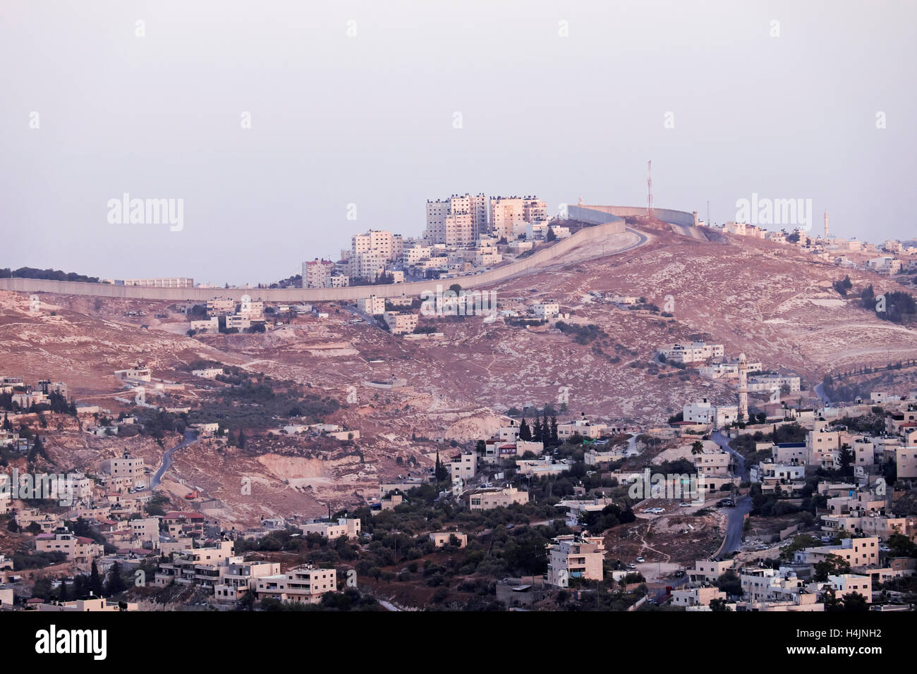 View of the Israeli West Bank separation barrier cutting through Abu ...