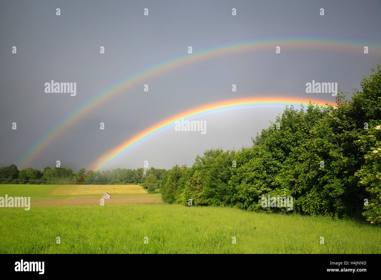 Double rainbow over fields during storm. Upper Bavaria. Germany Stock ...