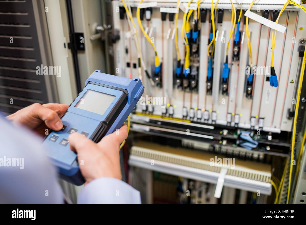 Technician using digital cable analyzer Stock Photo - Alamy