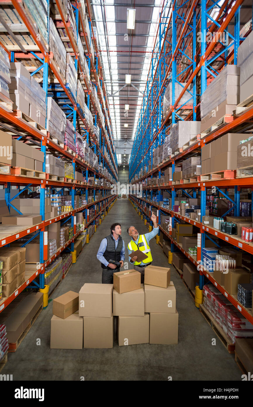 Warehouse workers checking the inventory Stock Photo - Alamy
