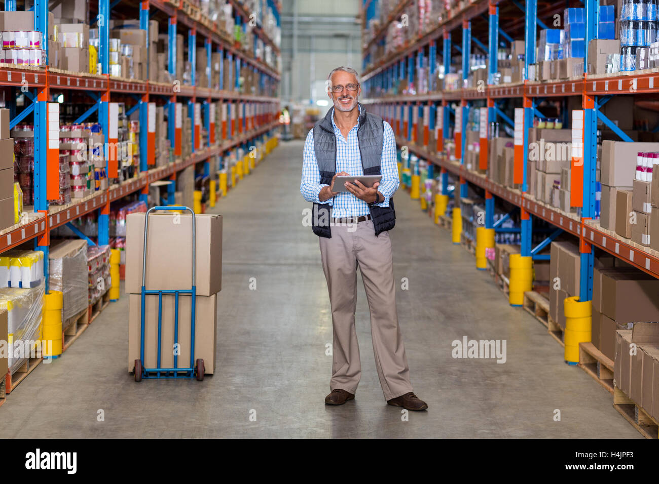 Holding digital tablet warehouse hi-res stock photography and images ...