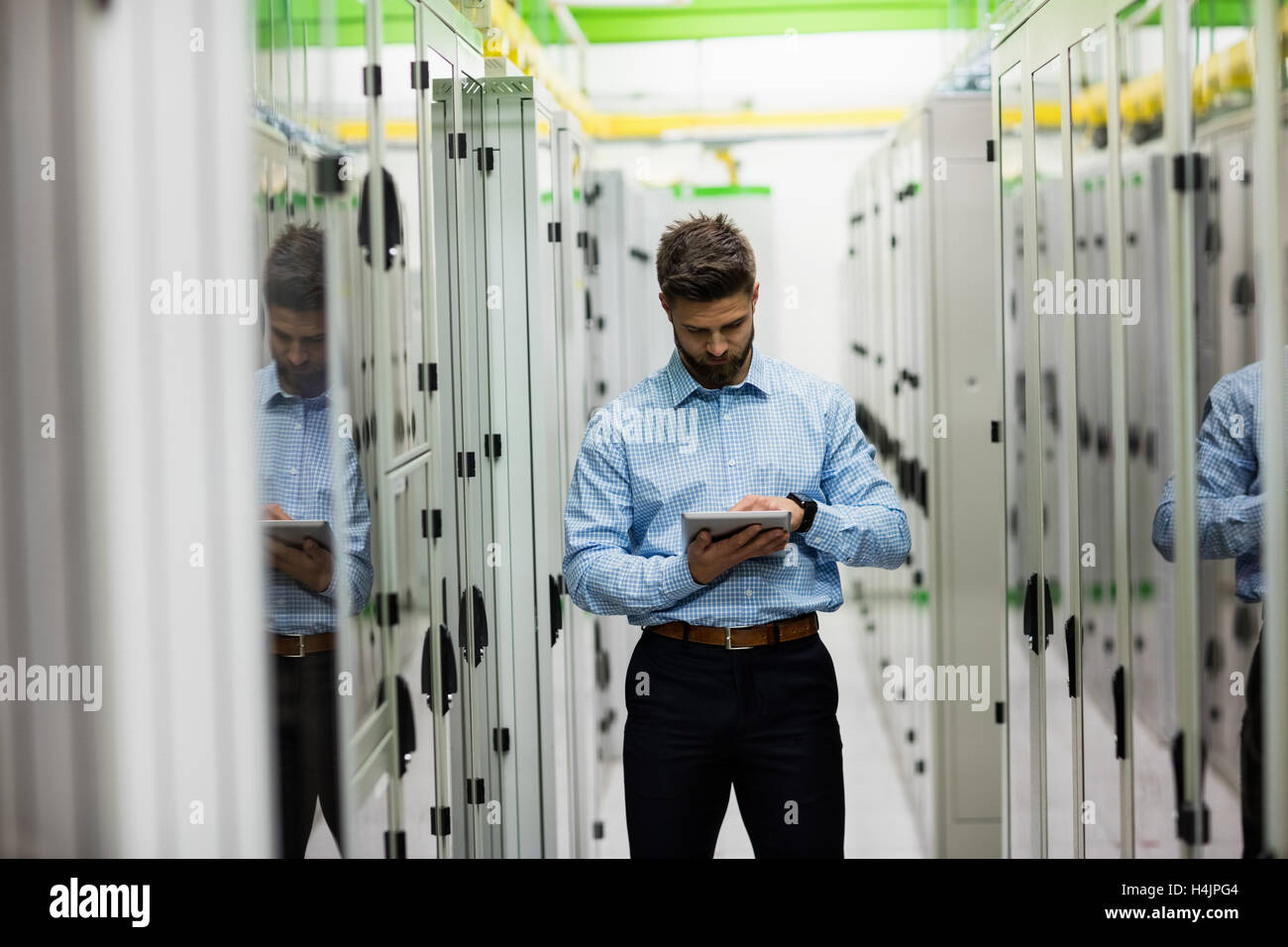 Technician using digital tablet Stock Photo - Alamy
