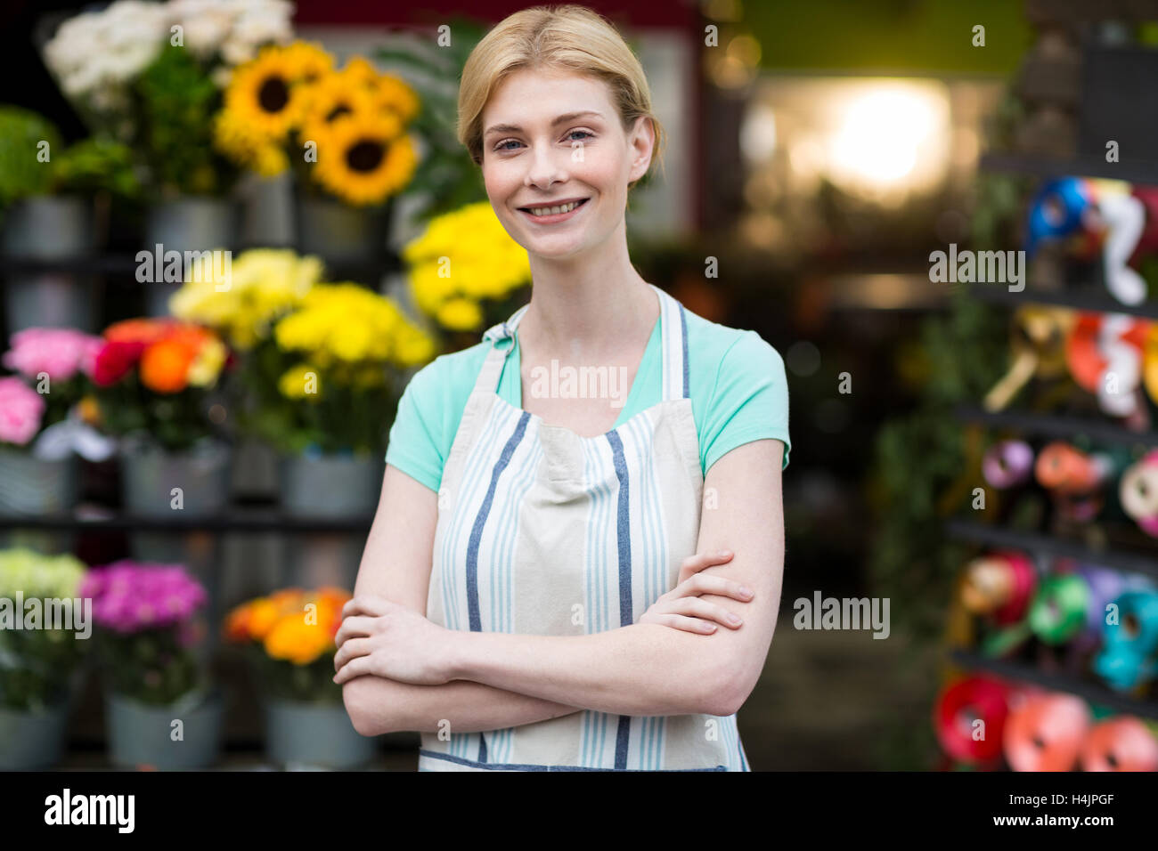 Portrait of female florist smiling Stock Photo - Alamy