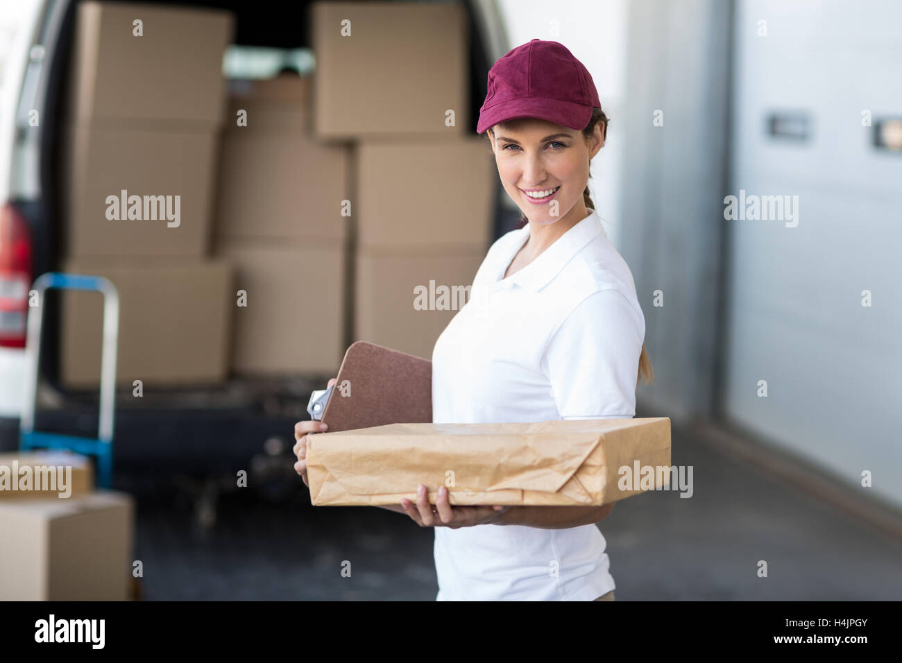Woman parcel shipping service hi-res stock photography and images - Alamy