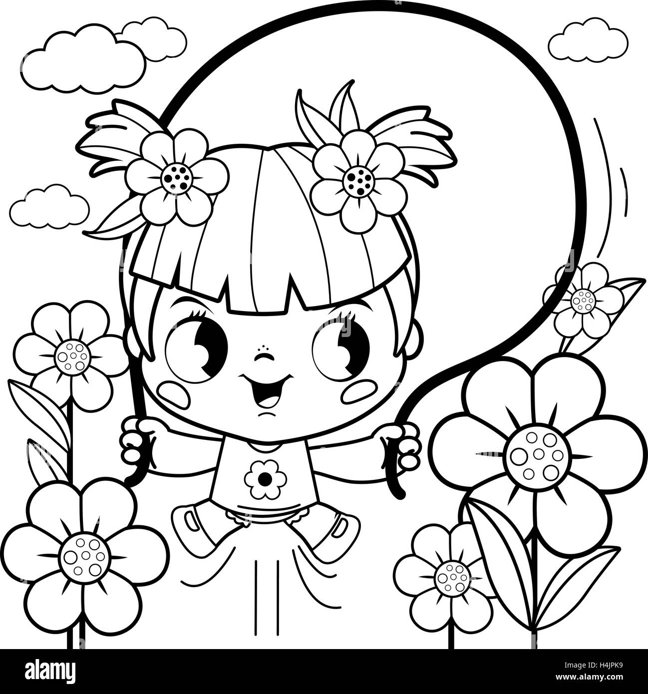 A happy little girl skipping and playing in the flower garden. Active ...