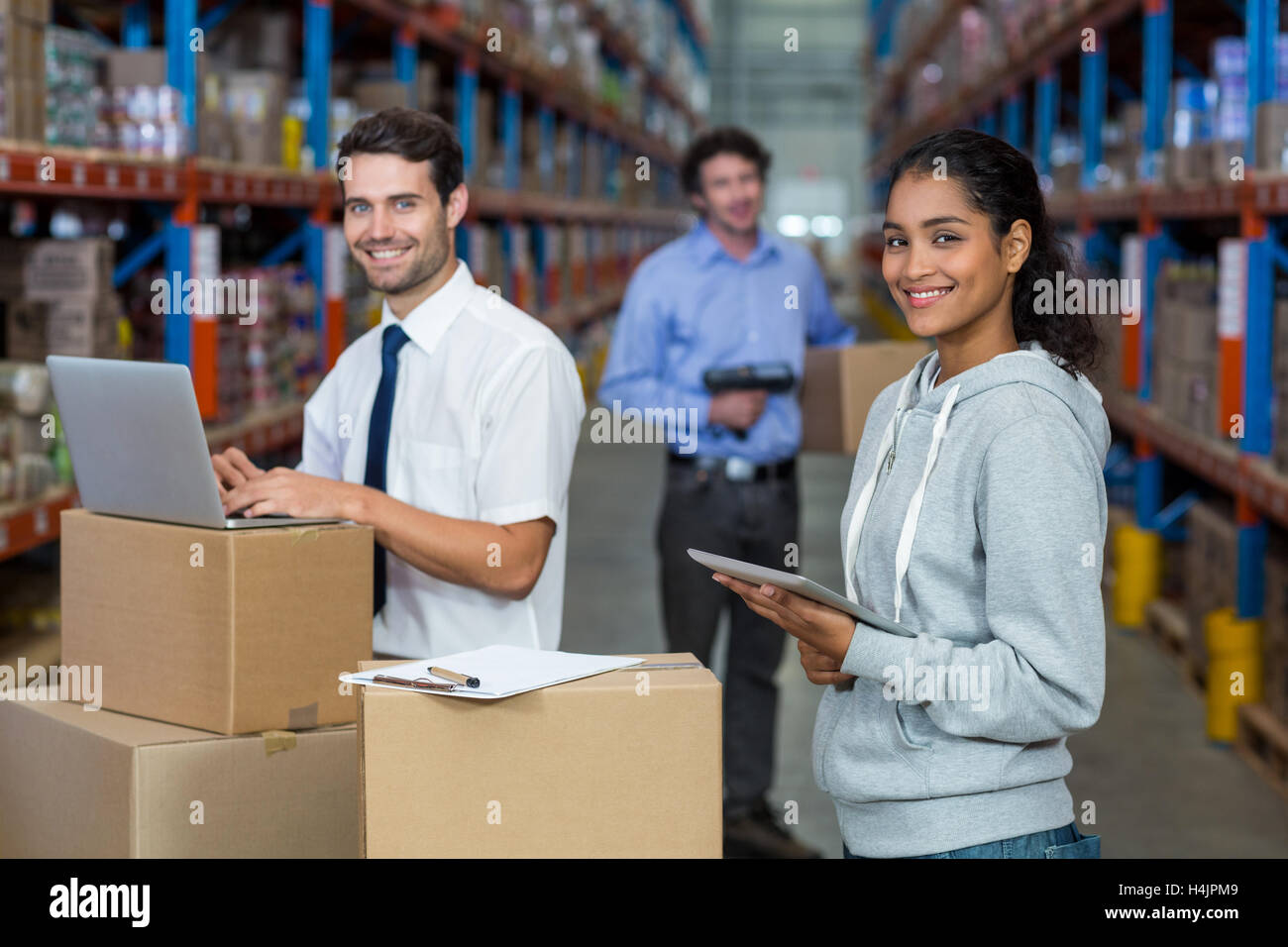 Portrait of warehouse worker standing together Stock Photo - Alamy