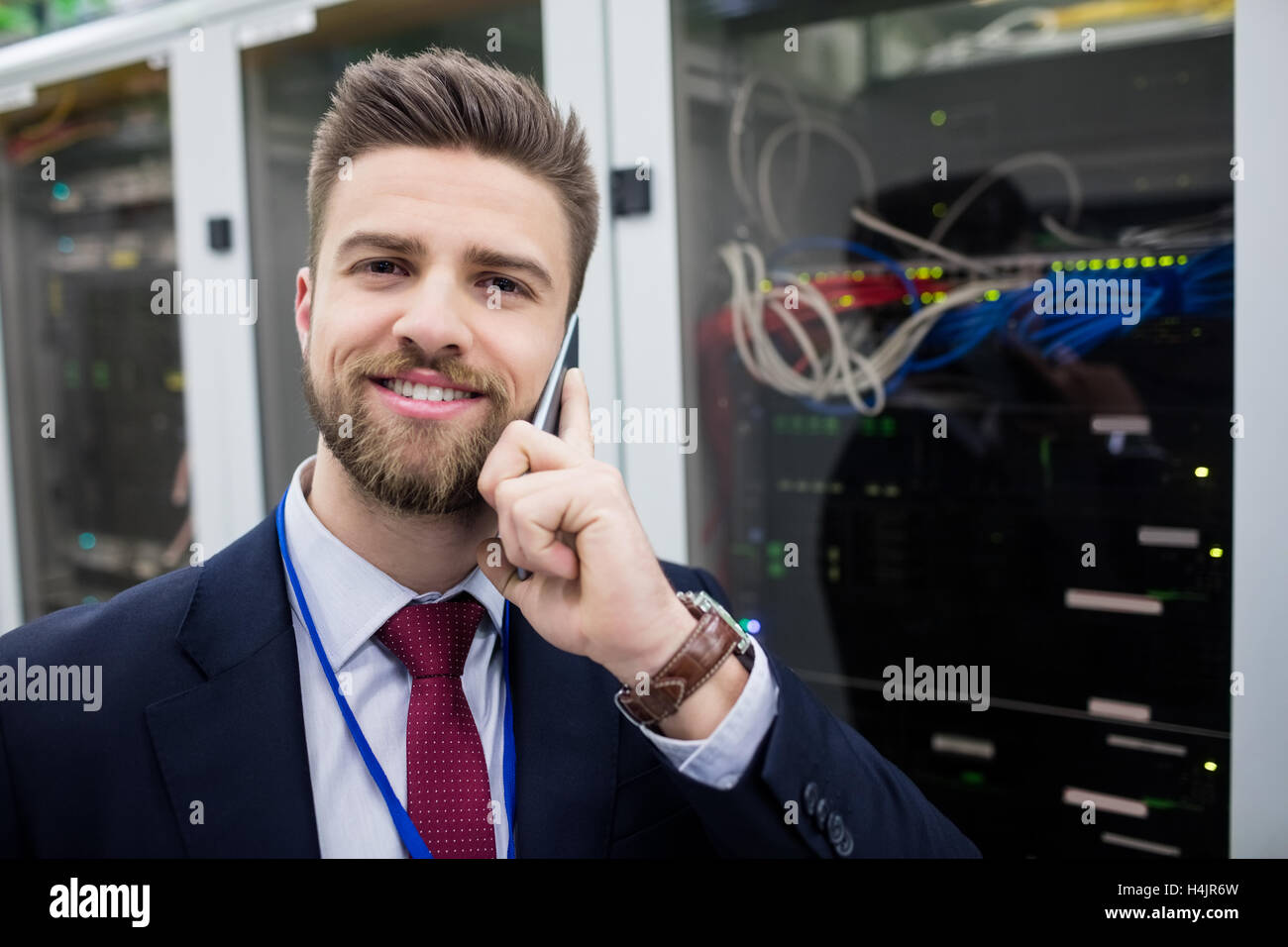 Technician talking on mobile phone Stock Photo - Alamy