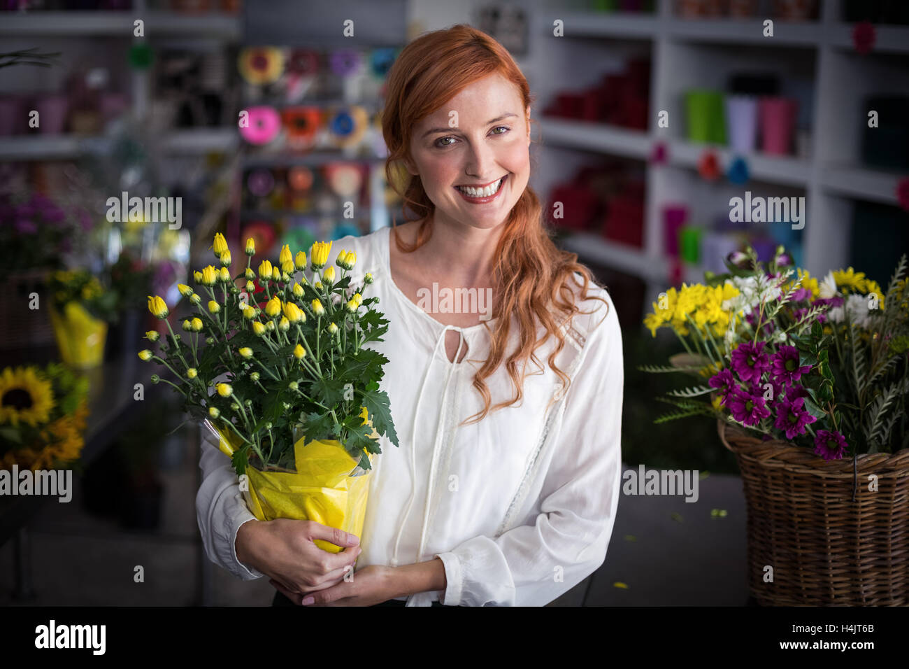 Cheerful florist holding bouquet hi-res stock photography and images ...
