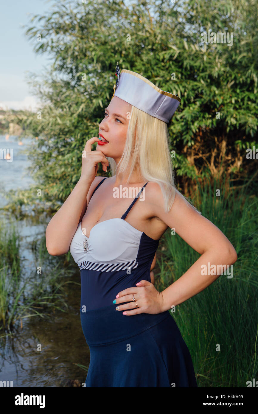Young retro pinup girl wearing sailor uniform Stock Photo - Alamy