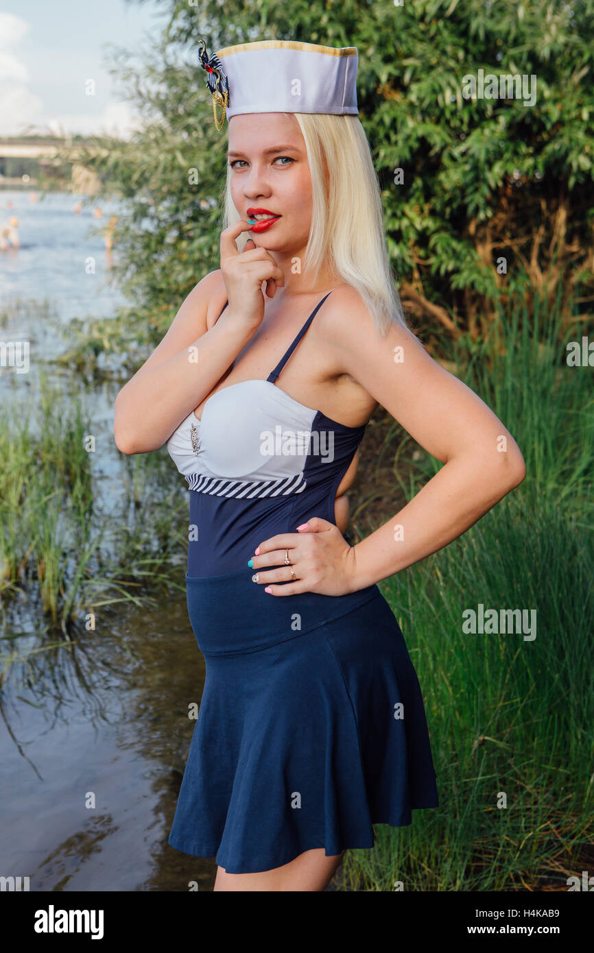 Young retro pinup girl wearing sailor uniform Stock Photo - Alamy