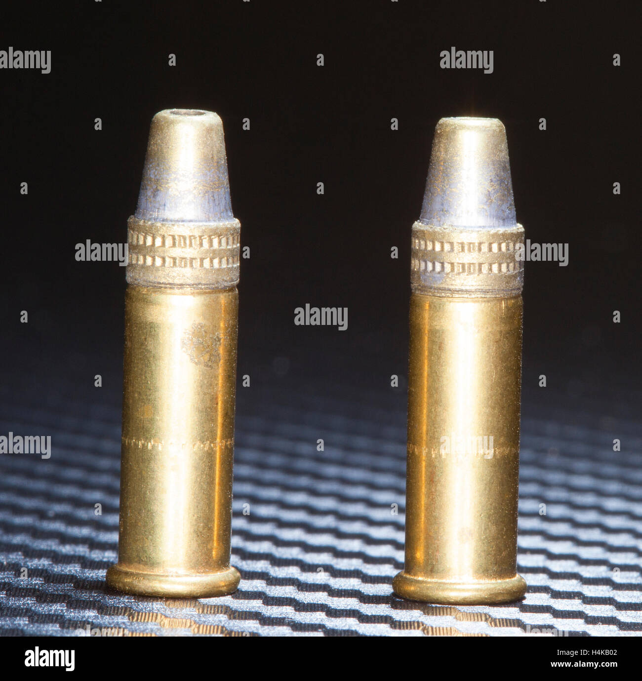 Two twenty two rounds on a graphite background Stock Photo - Alamy