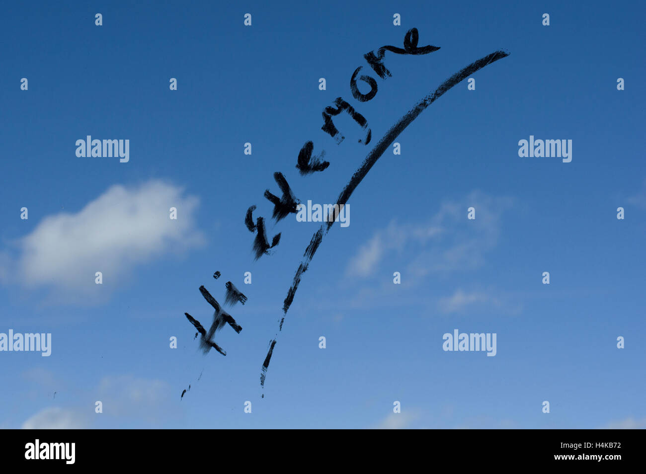 hi everyone scrawled in black marker on a window with blue skies and ...