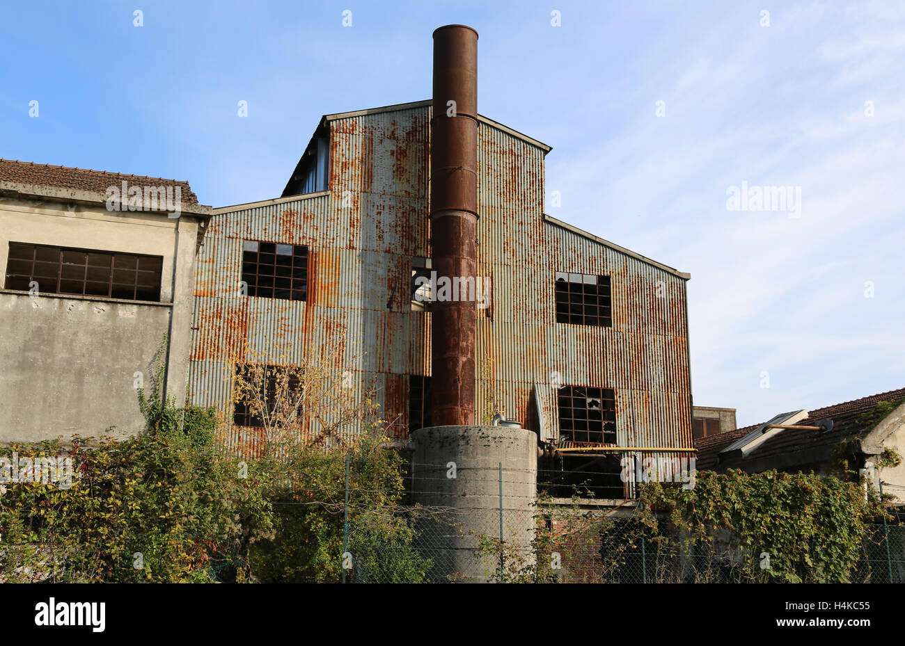 very big abbandoned factory with high chimney in East Europe Stock ...