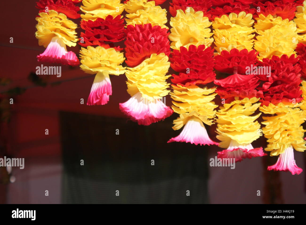 Dewali flower garland offering background copy space Stock Photo - Alamy