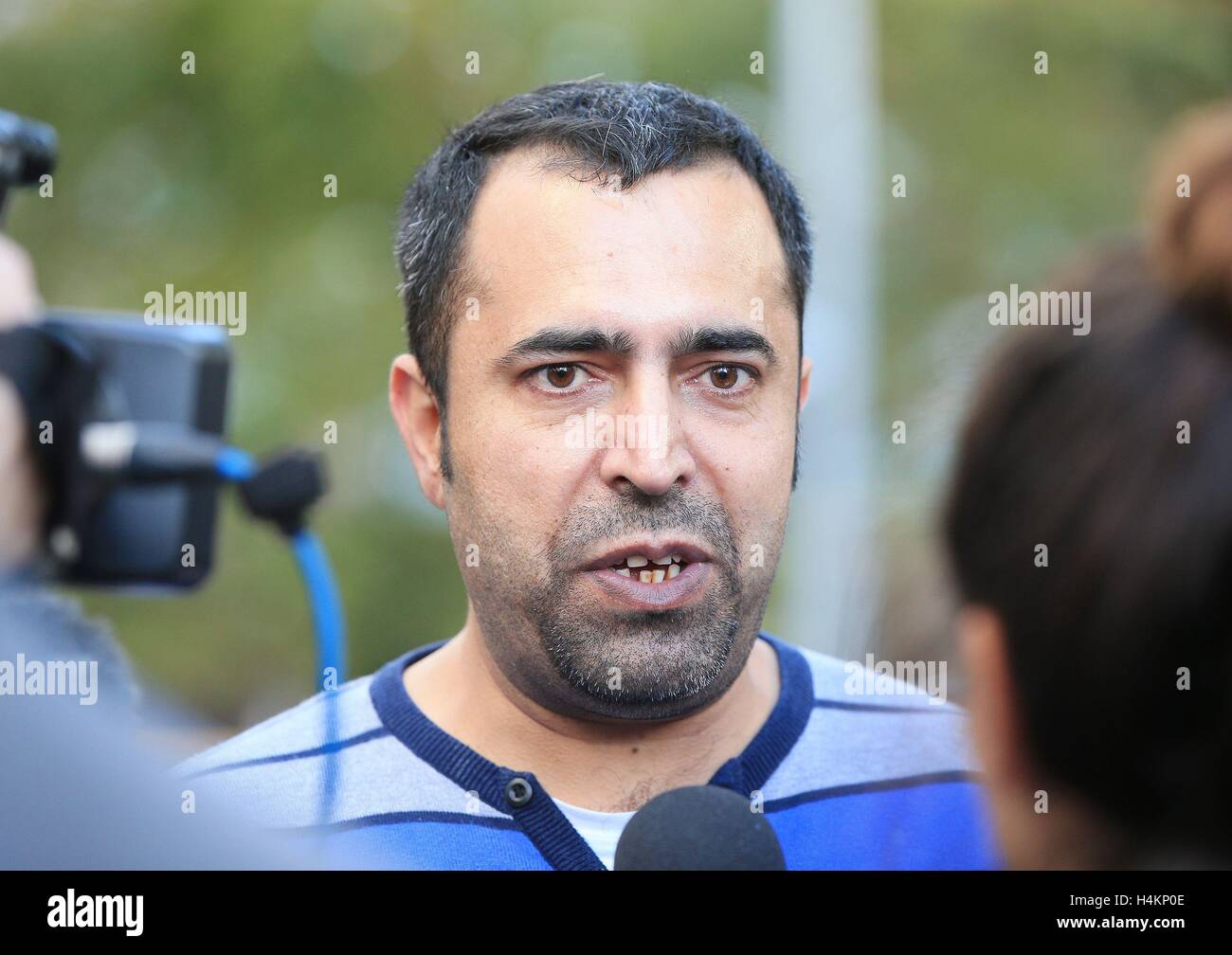 Jan Ghazi speaks to journalists outside Lunar House in Croydon while he ...
